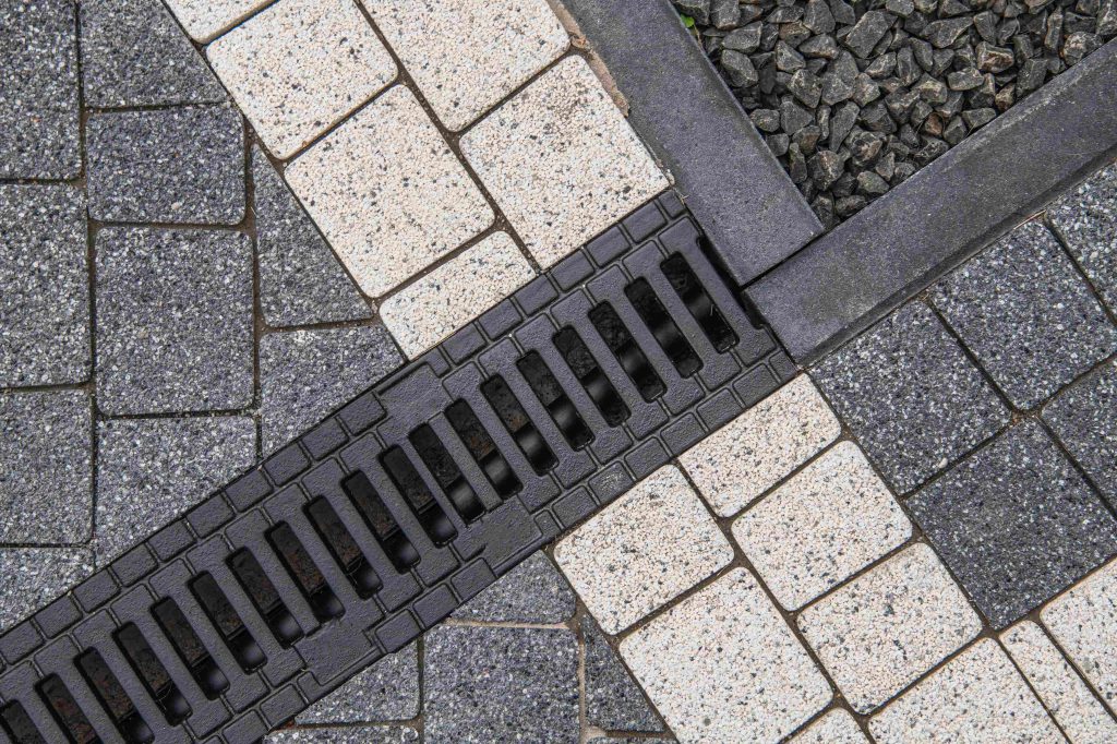 Channel Drains vs. Slot Drains: Which Works Best for Driveways?